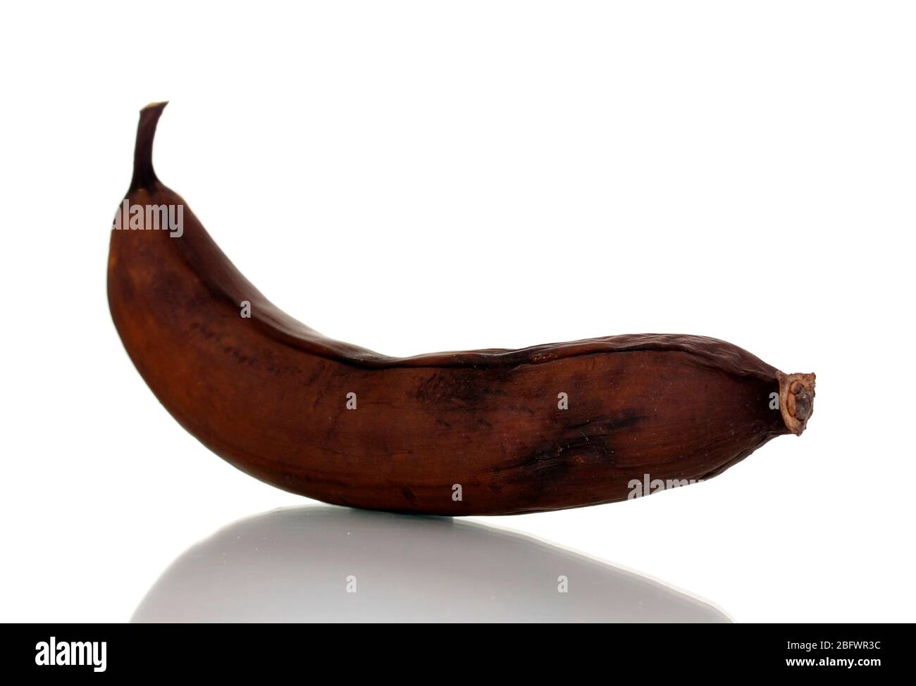 spoiled banana isolated on white Stock Photo - Alamy
