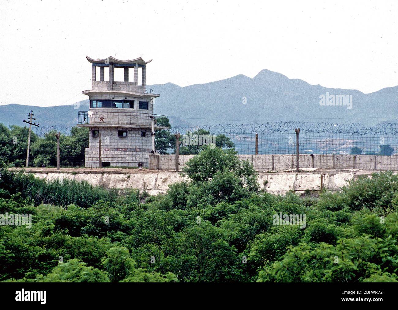 View of the concrete wall and barbed wire separating South Korea from ...