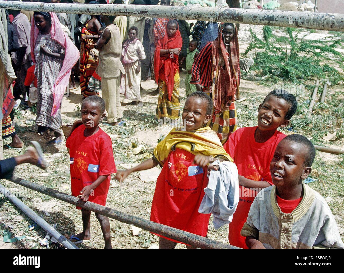 1993 - Somali children display the shirts given to them by Marines of ...