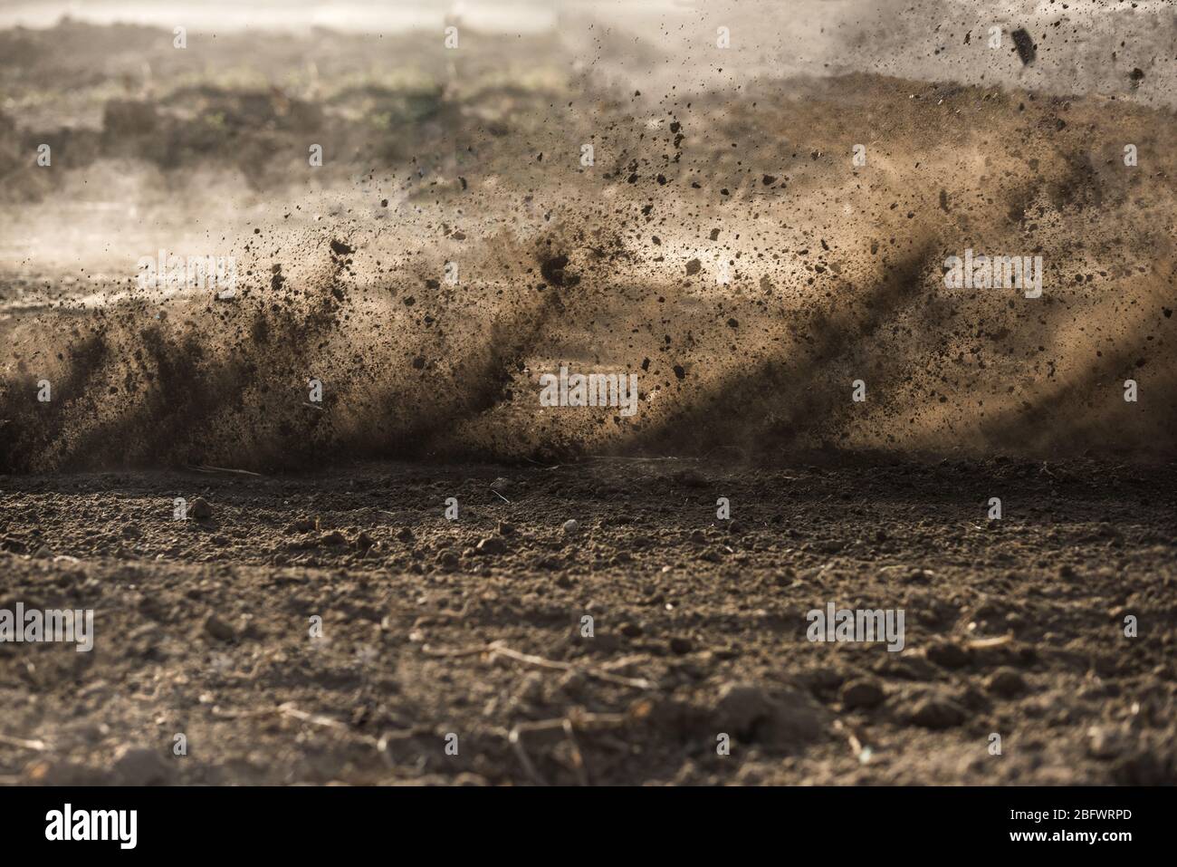 dirt fly after motocross roaring by Stock Photo - Alamy