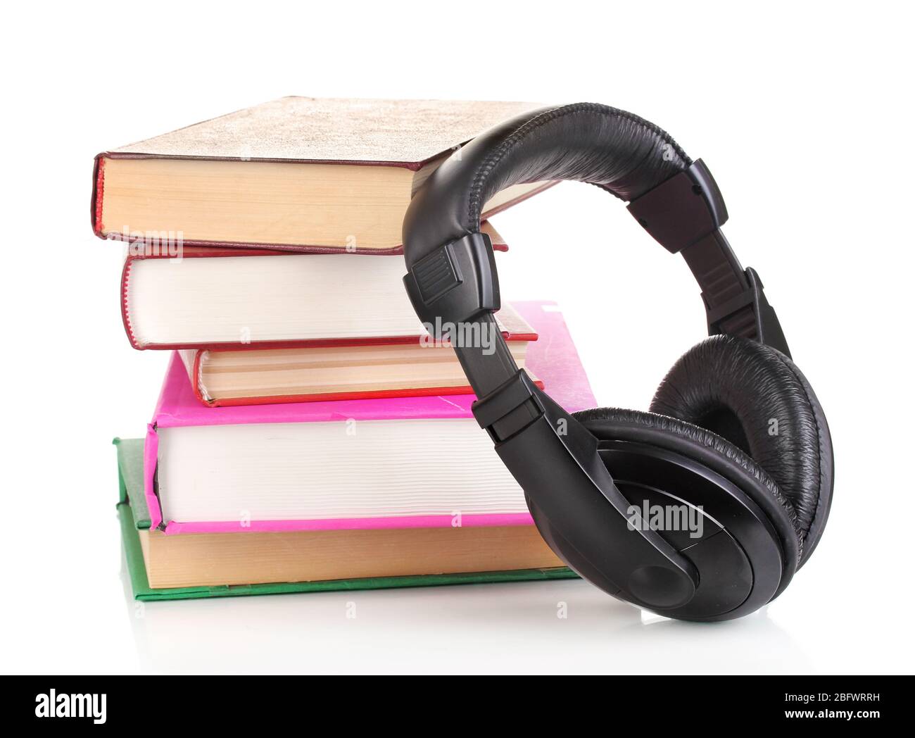 Headphones on books isolated on white Stock Photo - Alamy