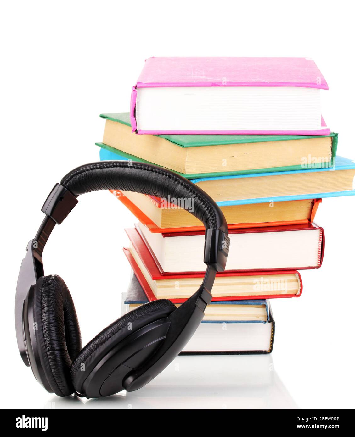 Headphones on books isolated on white Stock Photo - Alamy