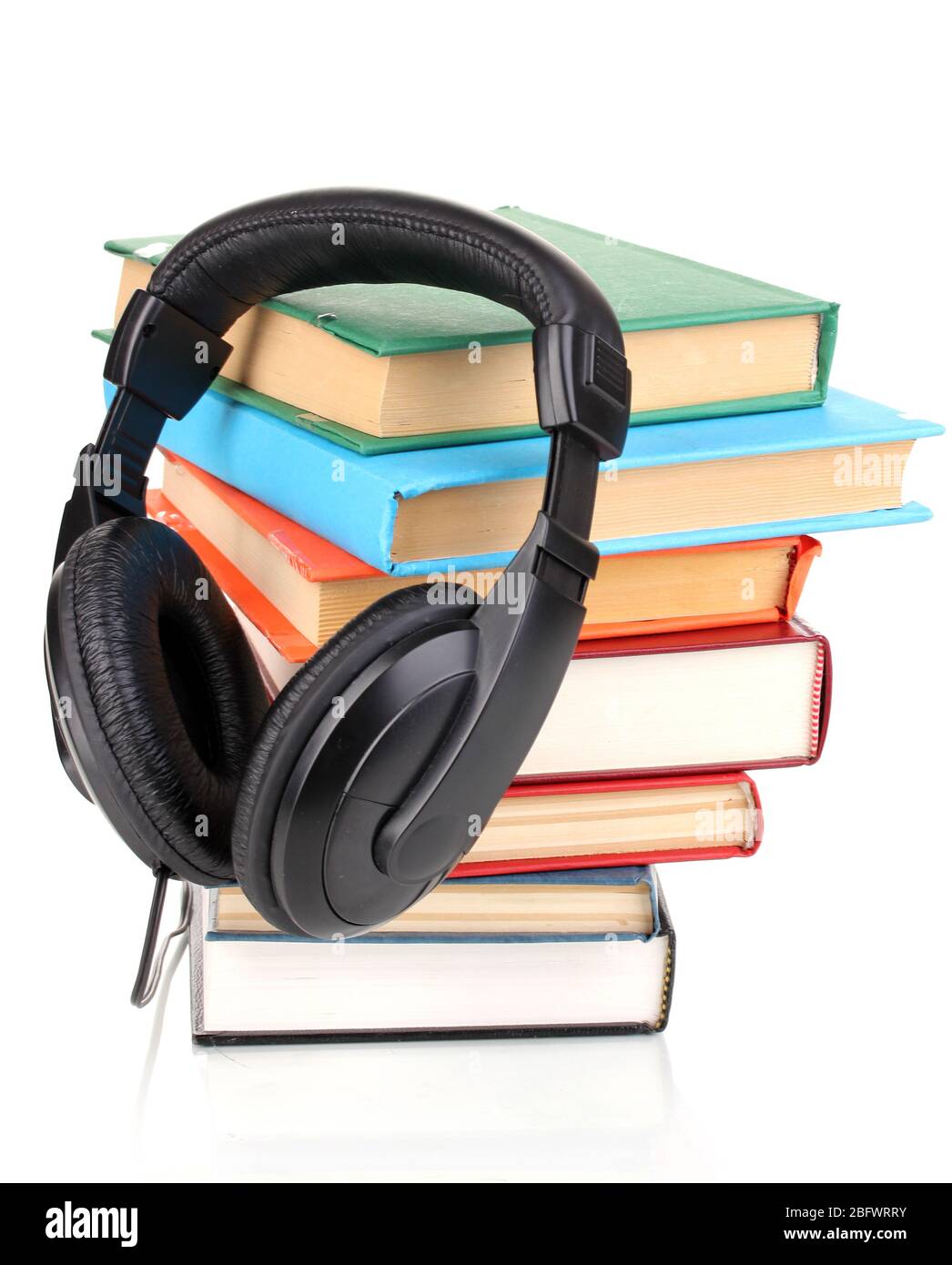 Headphones on books isolated on white Stock Photo - Alamy