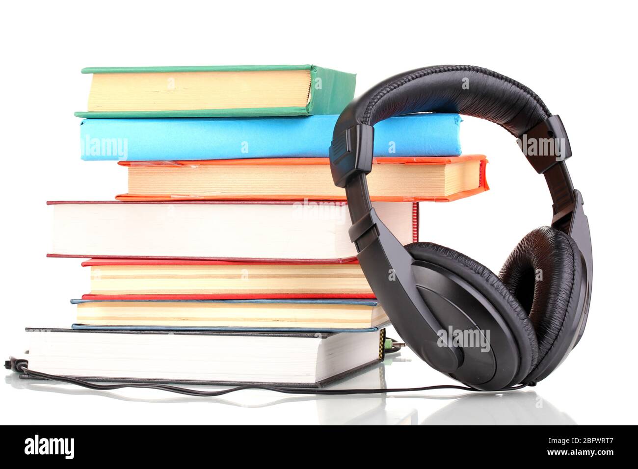 Headphones on books isolated on white Stock Photo - Alamy