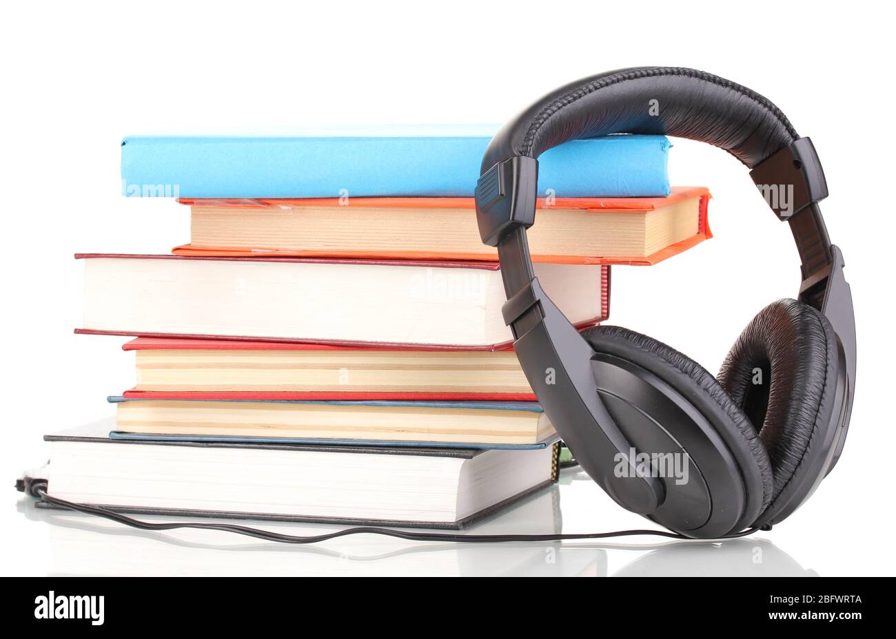 Headphones on books isolated on white Stock Photo - Alamy