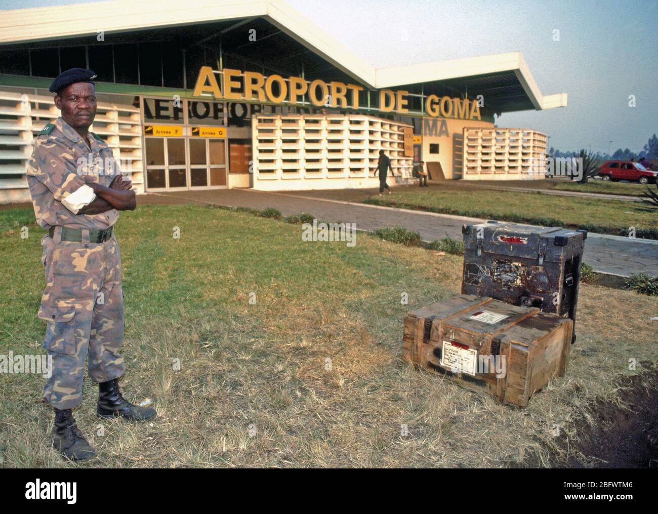1994 - A member of the Zaire armed forces stands in front of the ...