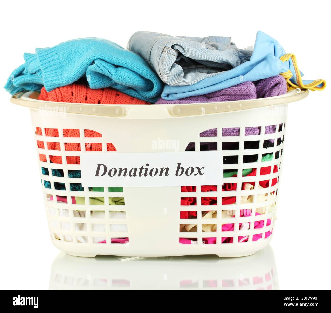 Donation box with clothing isolated on white Stock Photo - Alamy