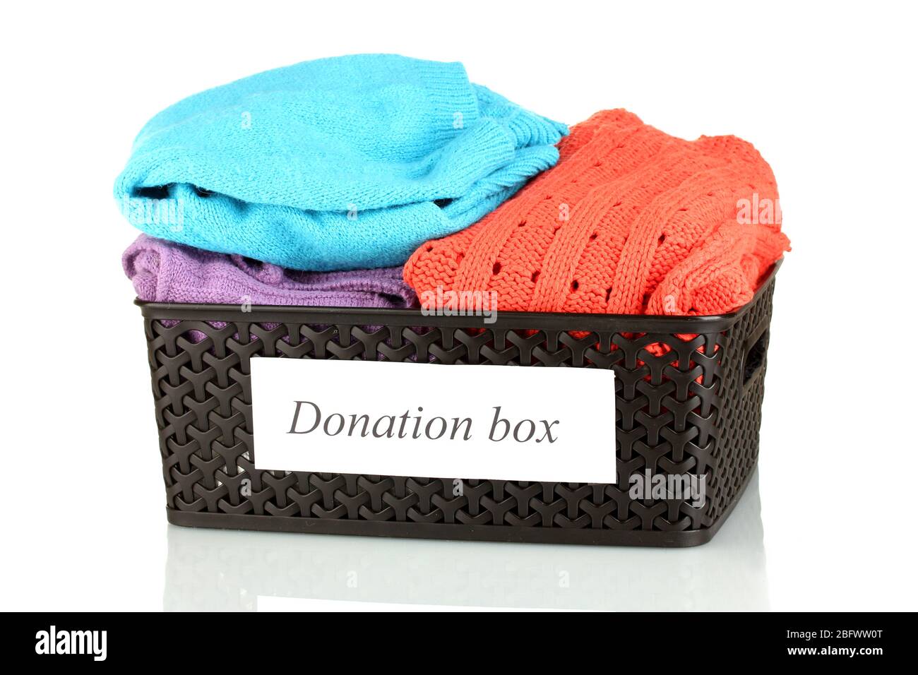 Donation box with clothing isolated on white Stock Photo - Alamy