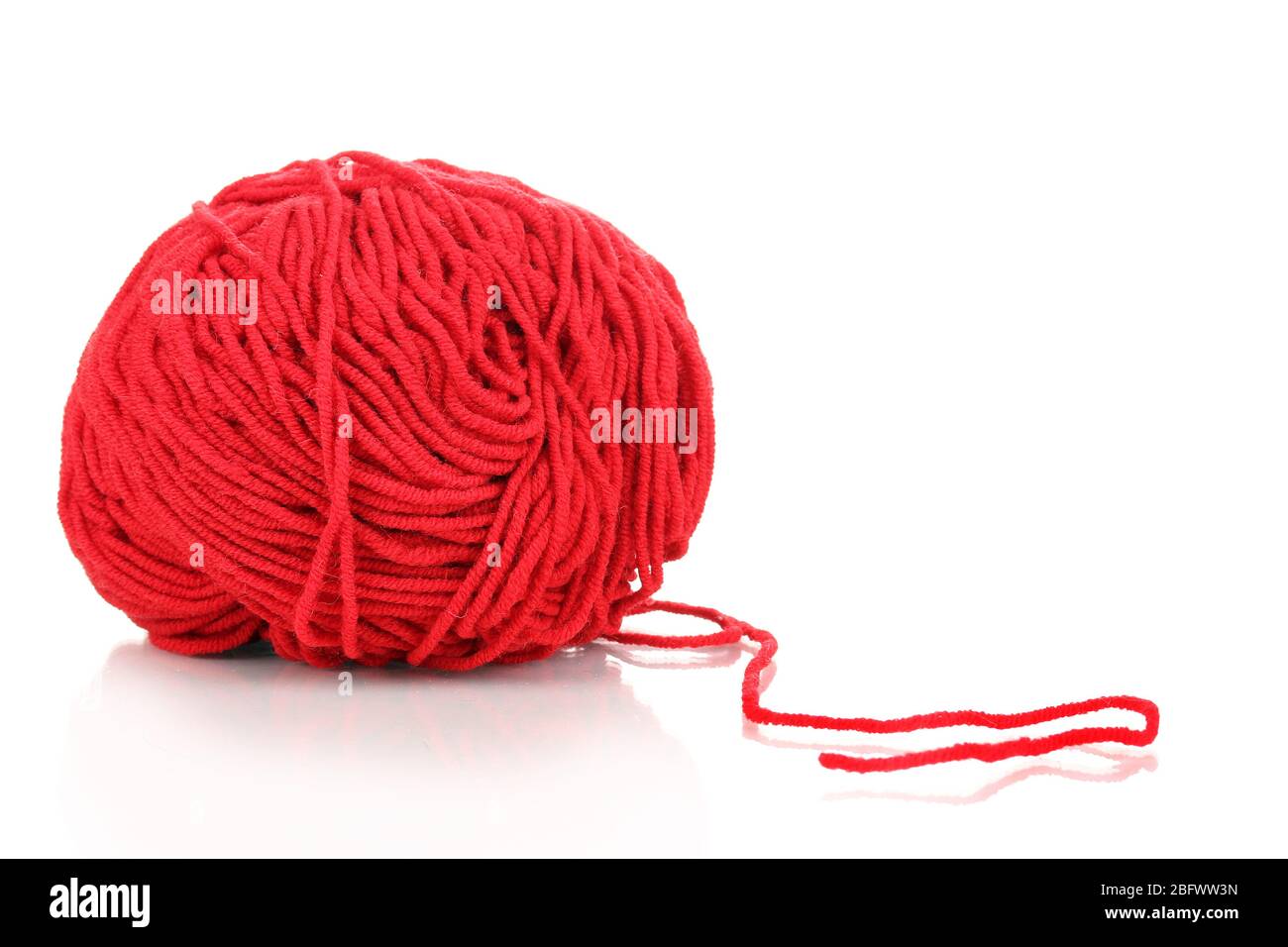 Red knitting yarn isolated on white Stock Photo - Alamy