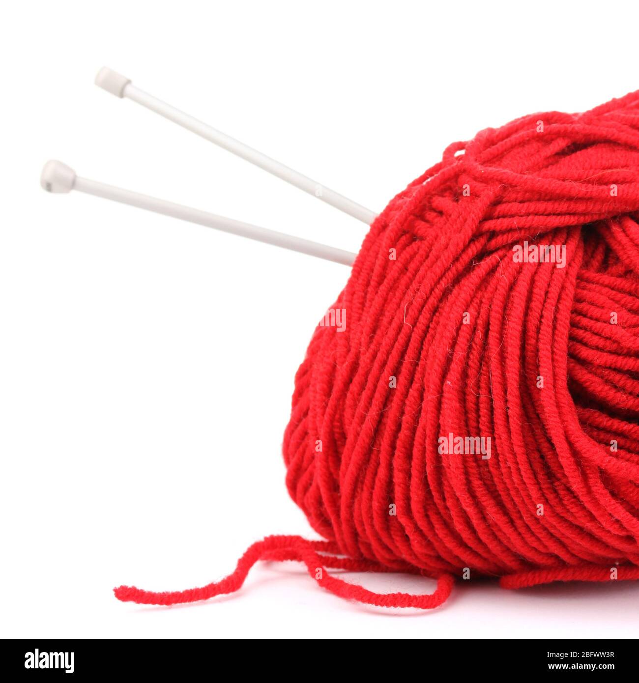 Red knitting yarn isolated on white Stock Photo - Alamy