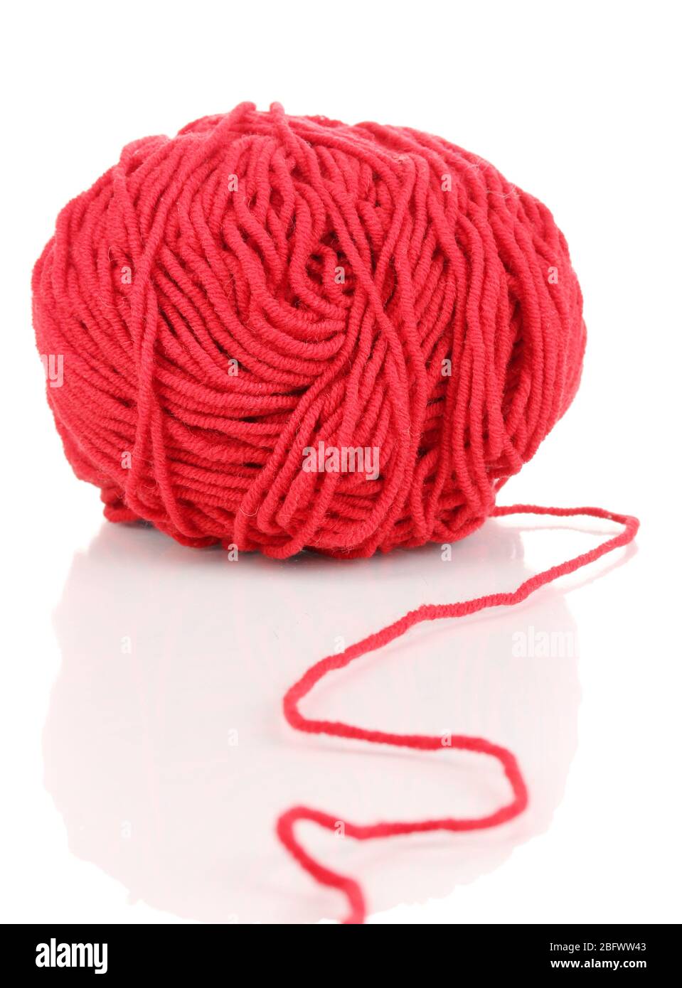 Red knitting yarn isolated on white Stock Photo - Alamy
