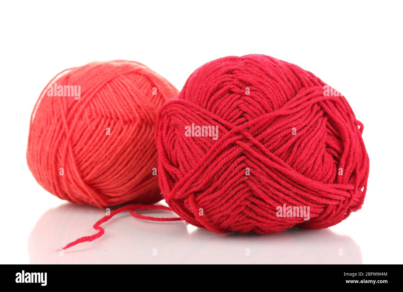 Red knittings yarns isolated on white Stock Photo - Alamy