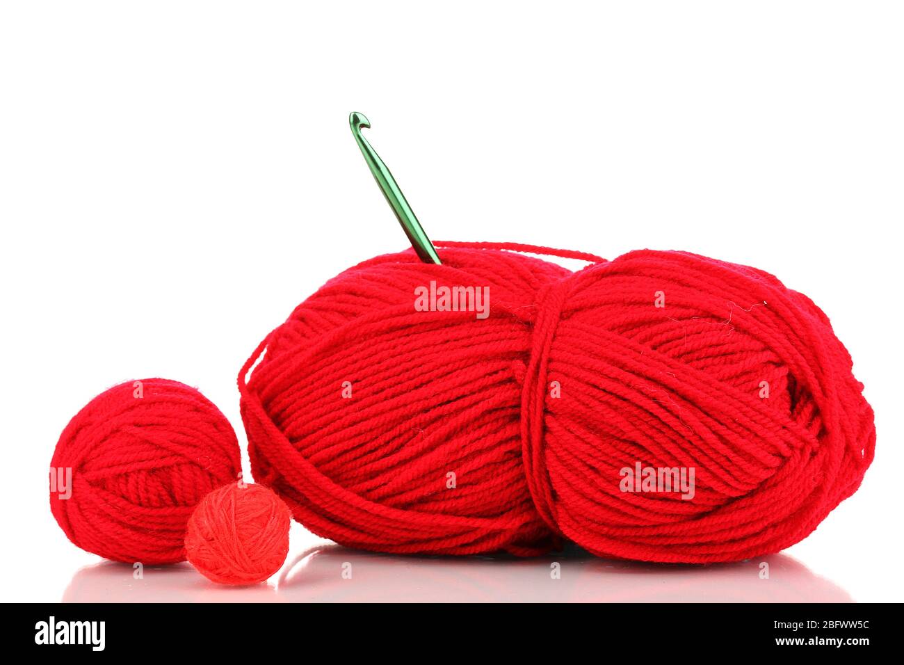 Red knittings yarns isolated on white Stock Photo - Alamy