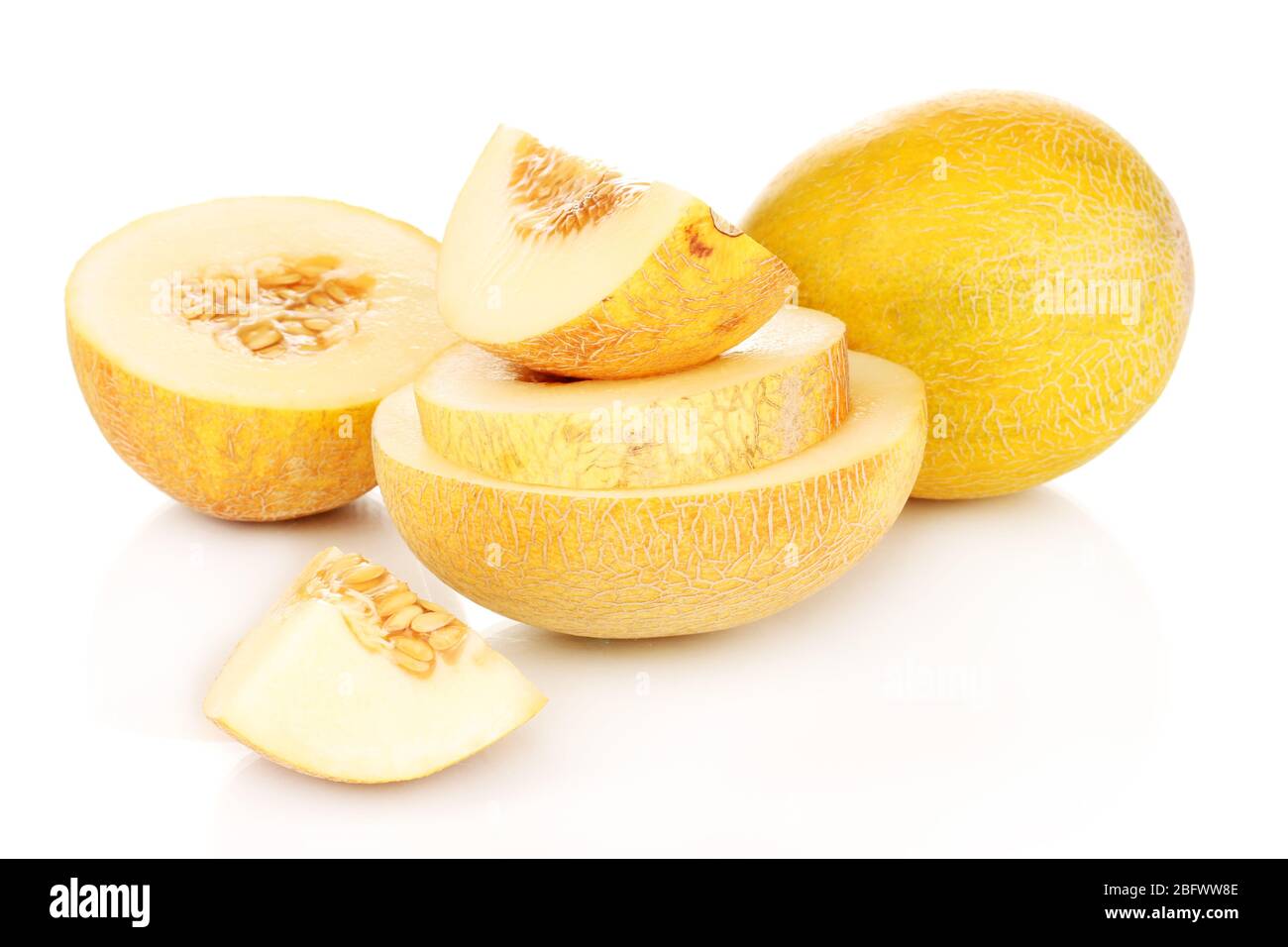 Cut ripe melons isolated on white Stock Photo - Alamy