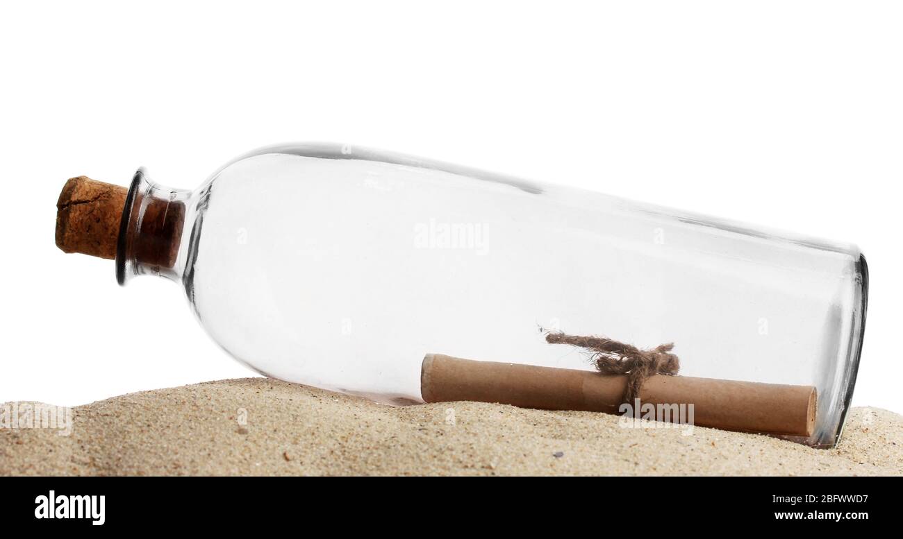 Glass bottle with note inside on sand isolated on white Stock Photo - Alamy