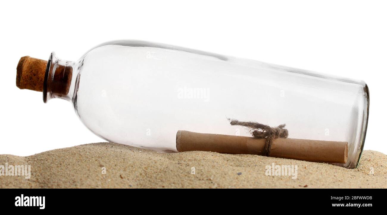 Glass bottle with note inside on sand isolated on white Stock Photo - Alamy