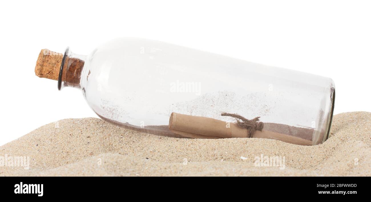 Glass bottle with note inside on sand isolated on white Stock Photo - Alamy
