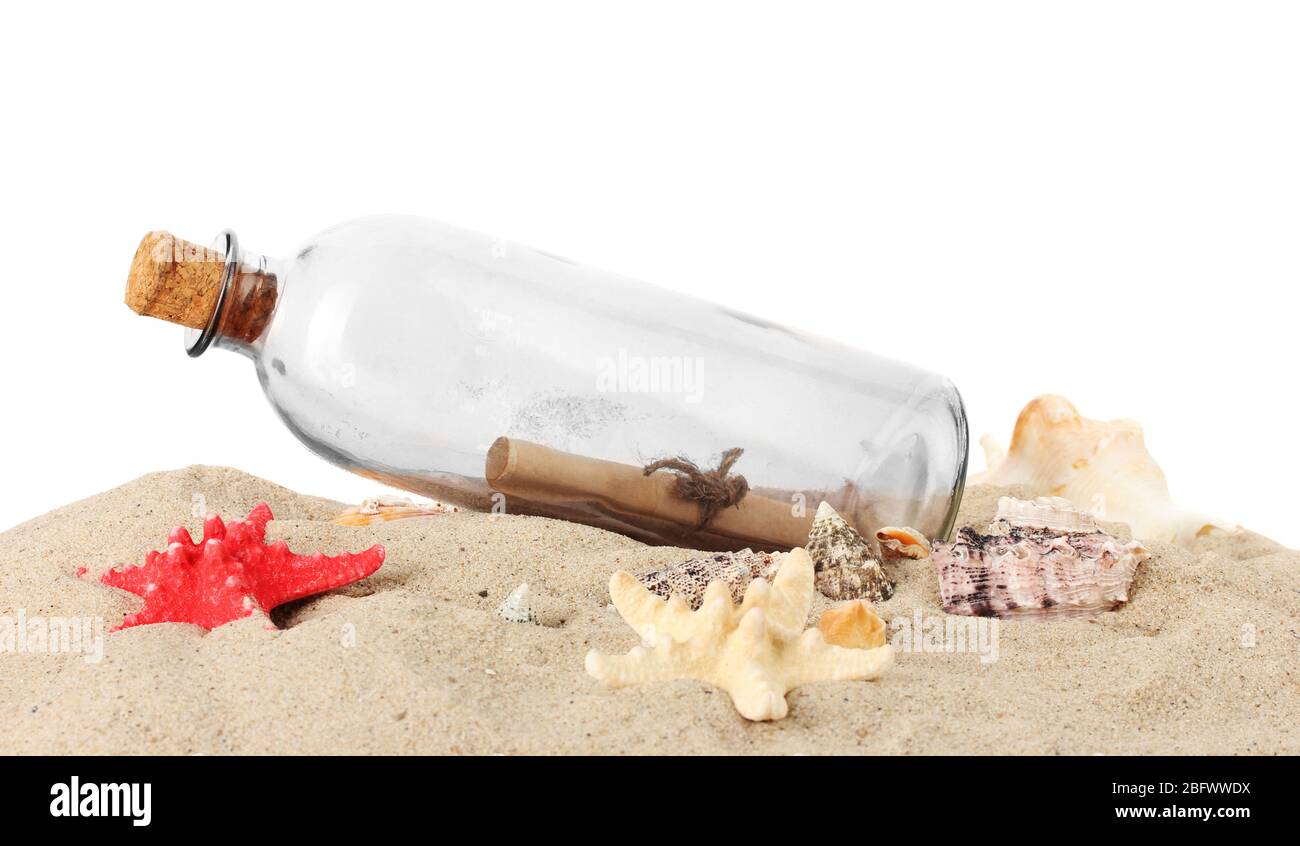 Glass bottle with note inside on sand isolated on white Stock Photo - Alamy