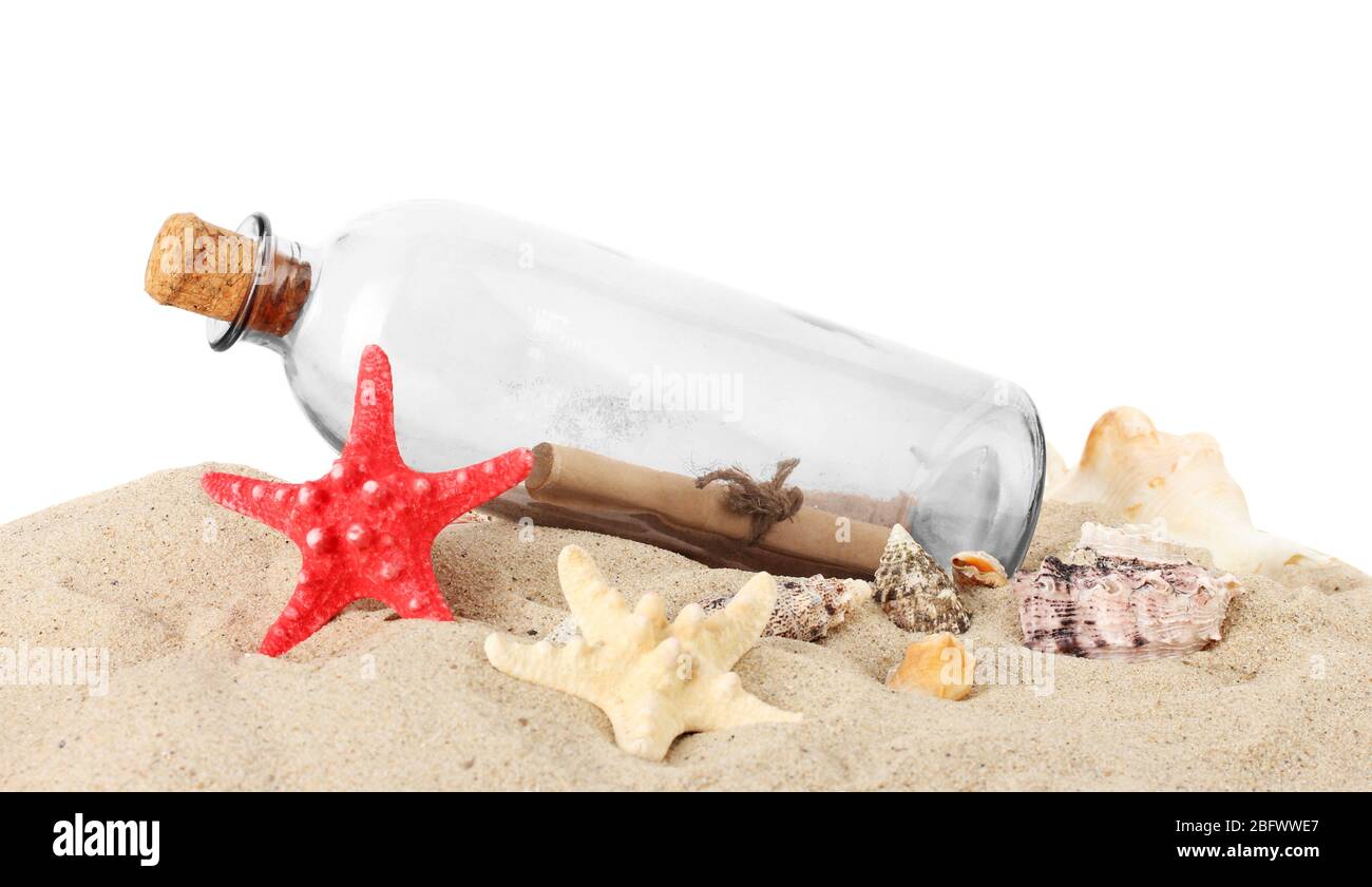 Glass bottle with note inside on sand isolated on white Stock Photo - Alamy