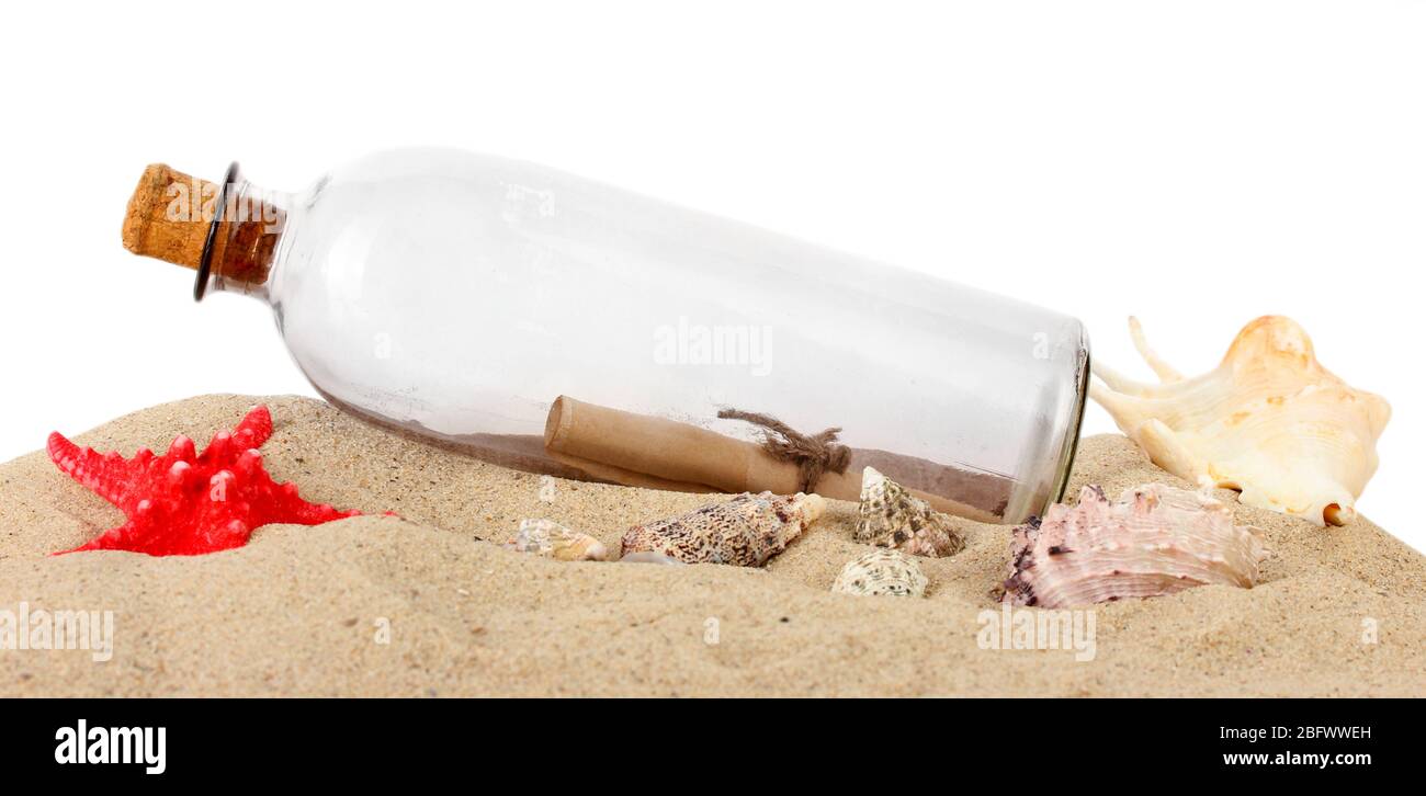 Glass bottle with note inside on sand isolated on white Stock Photo - Alamy