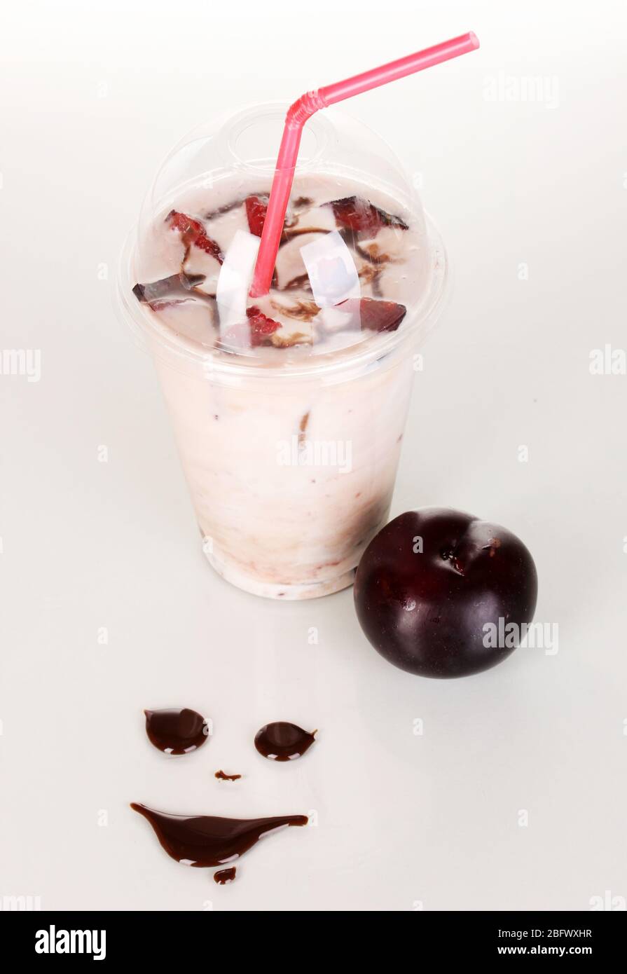 Delicious milk shake with fruit isolated on white Stock Photo - Alamy