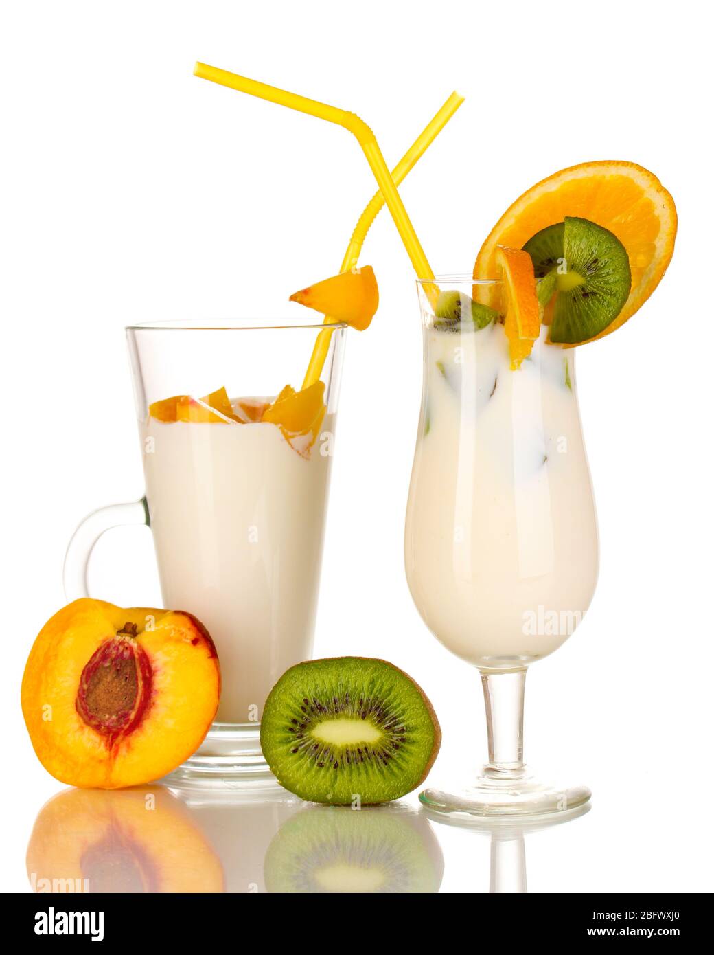 Delicious milk shakes with fruit isolated on white Stock Photo - Alamy