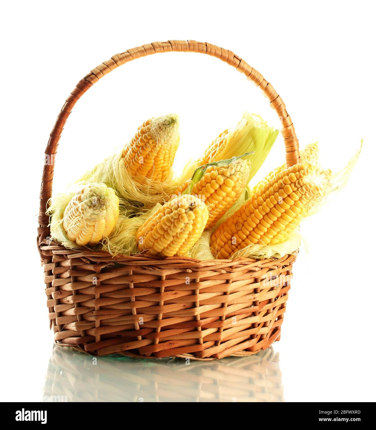 fresh corn in basket, isolated on white Stock Photo - Alamy