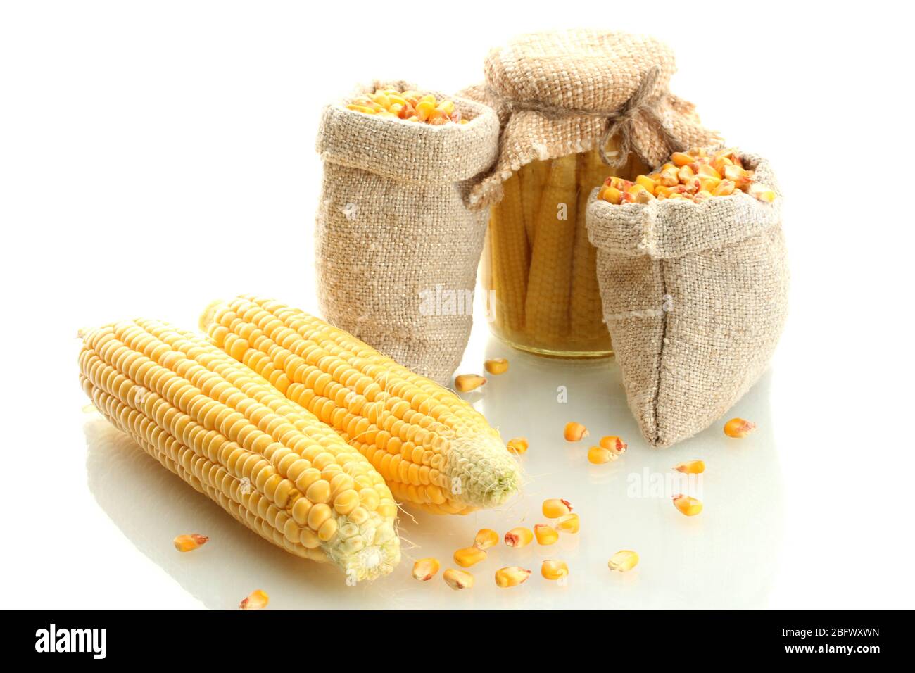 fresh corn and bags with dry corn, isolated on white Stock Photo - Alamy