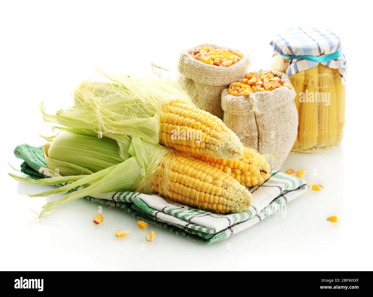 fresh corn and bags with dry corn, isolated on white Stock Photo - Alamy