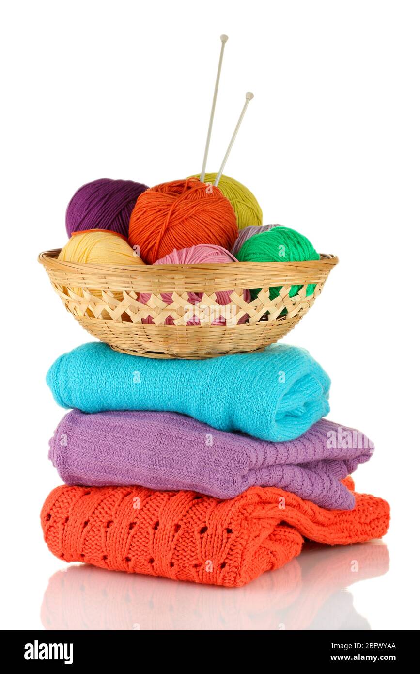 Sweaters and balls of wool isolated on white Stock Photo - Alamy