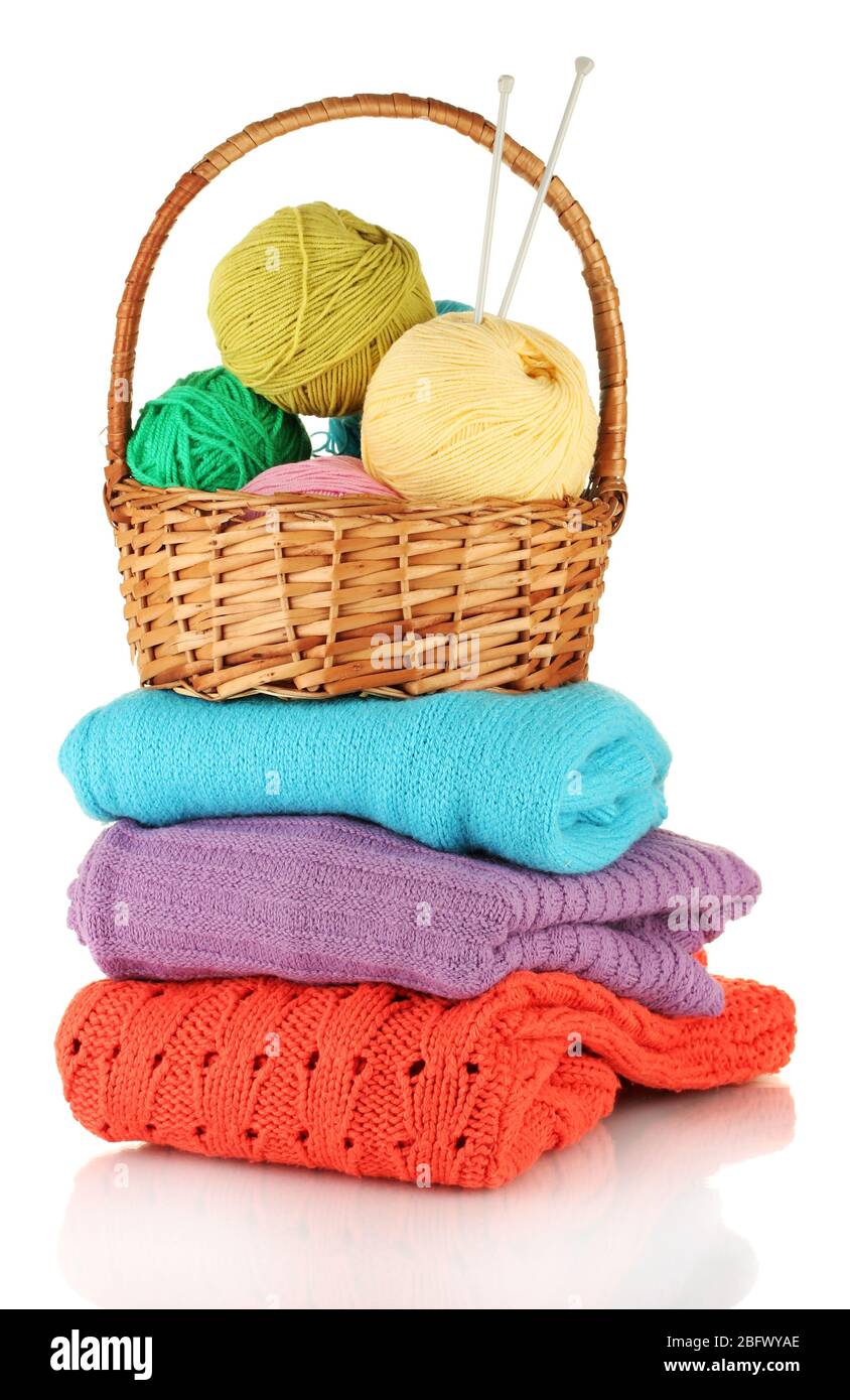 Sweaters and balls of wool isolated on white Stock Photo - Alamy