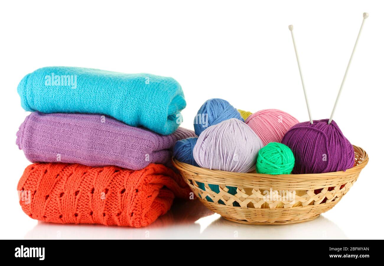 Sweaters and balls of wool isolated on white Stock Photo - Alamy