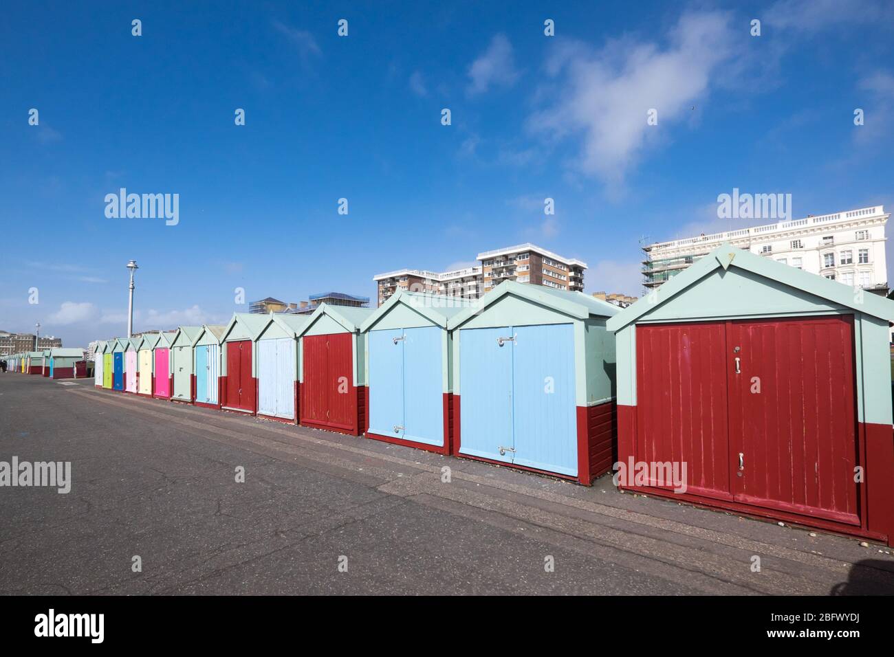 Beach huts on Hove seafront in Brighton, Sussex, UK, with apartment ...