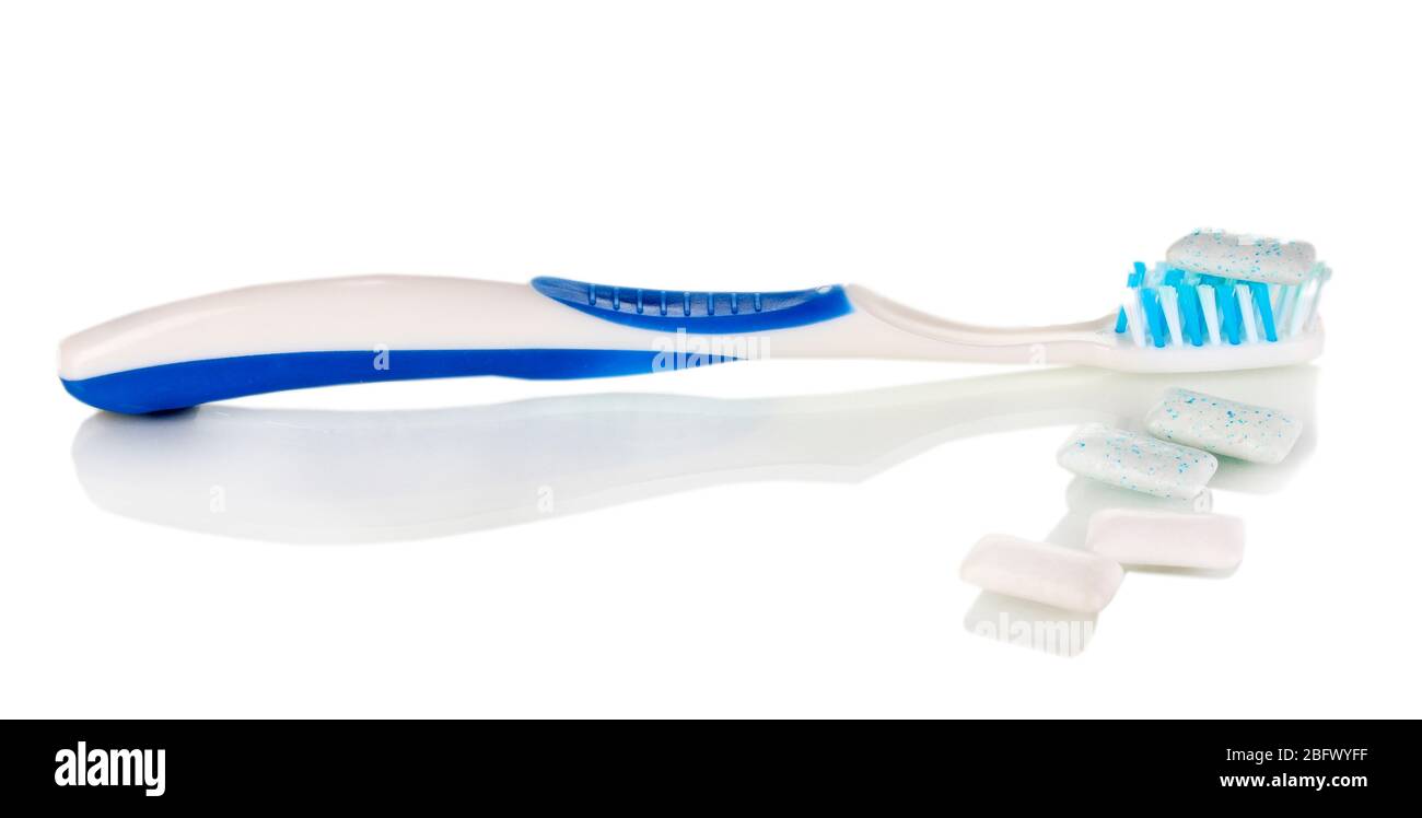 Chewing gum and toothbrush isolated on white Stock Photo - Alamy
