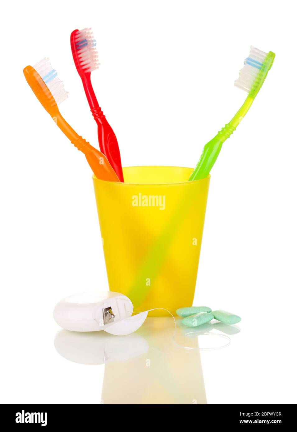 Toothbrushes, chewing gum and dental floss isolated on white Stock ...
