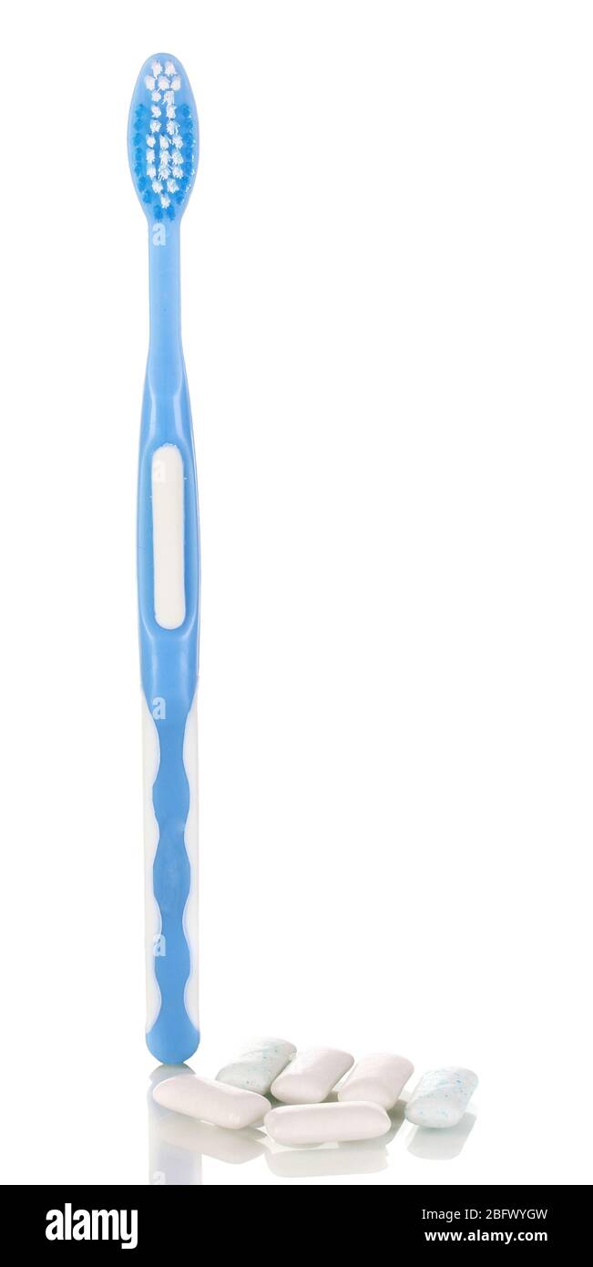 Toothbrush and chewing gum isolated on white Stock Photo - Alamy