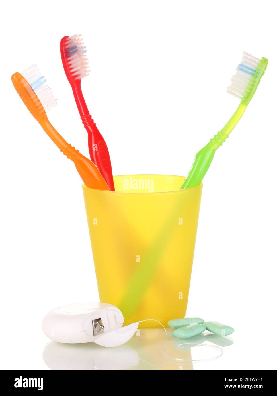 Toothbrushes, chewing gum and dental floss isolated on white Stock ...