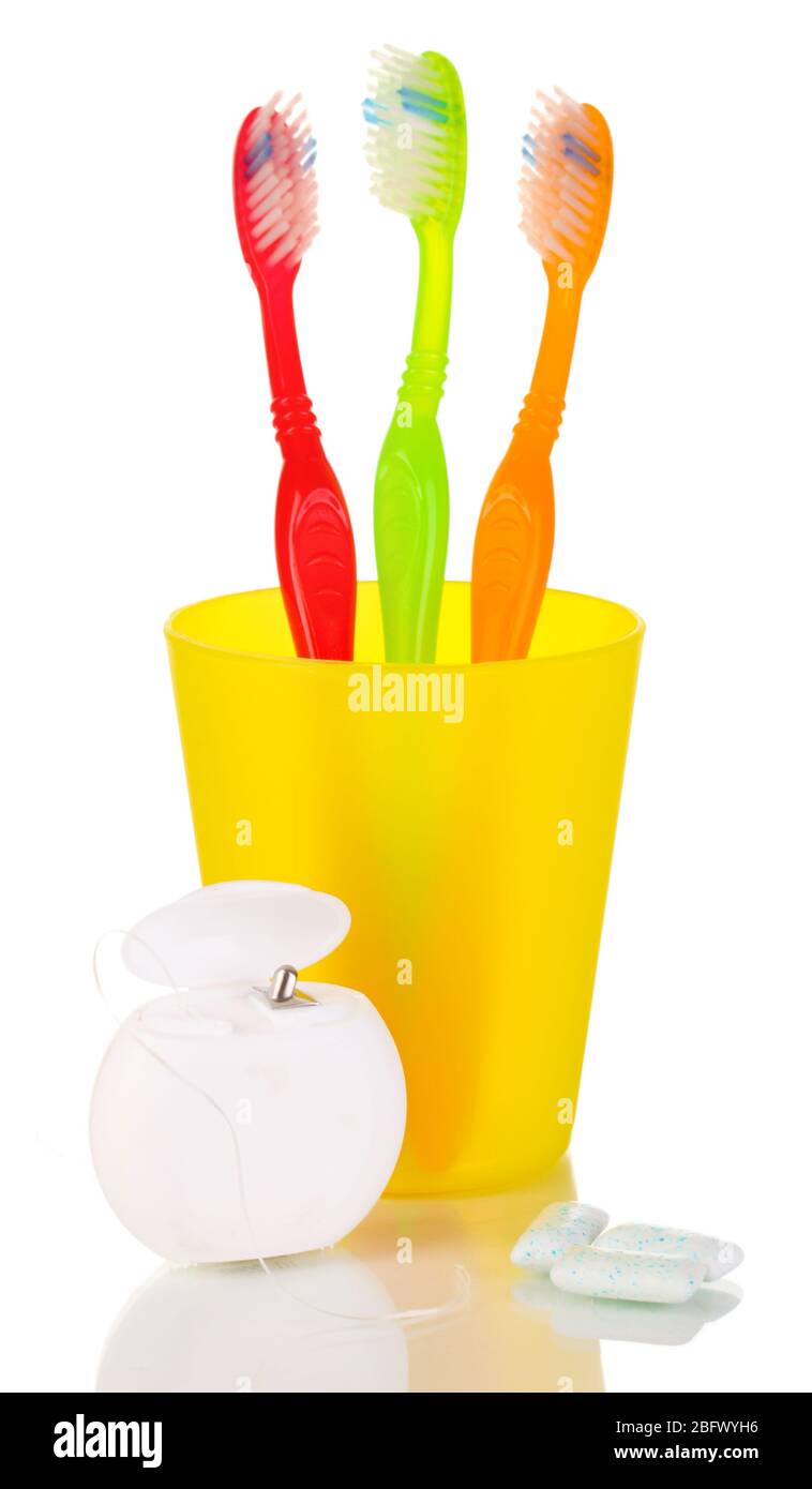 Toothbrushes, chewing gum and dental floss isolated on white Stock ...