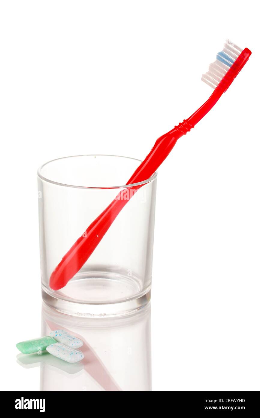 Toothbrush in glass and chewing gum isolated on white Stock Photo - Alamy