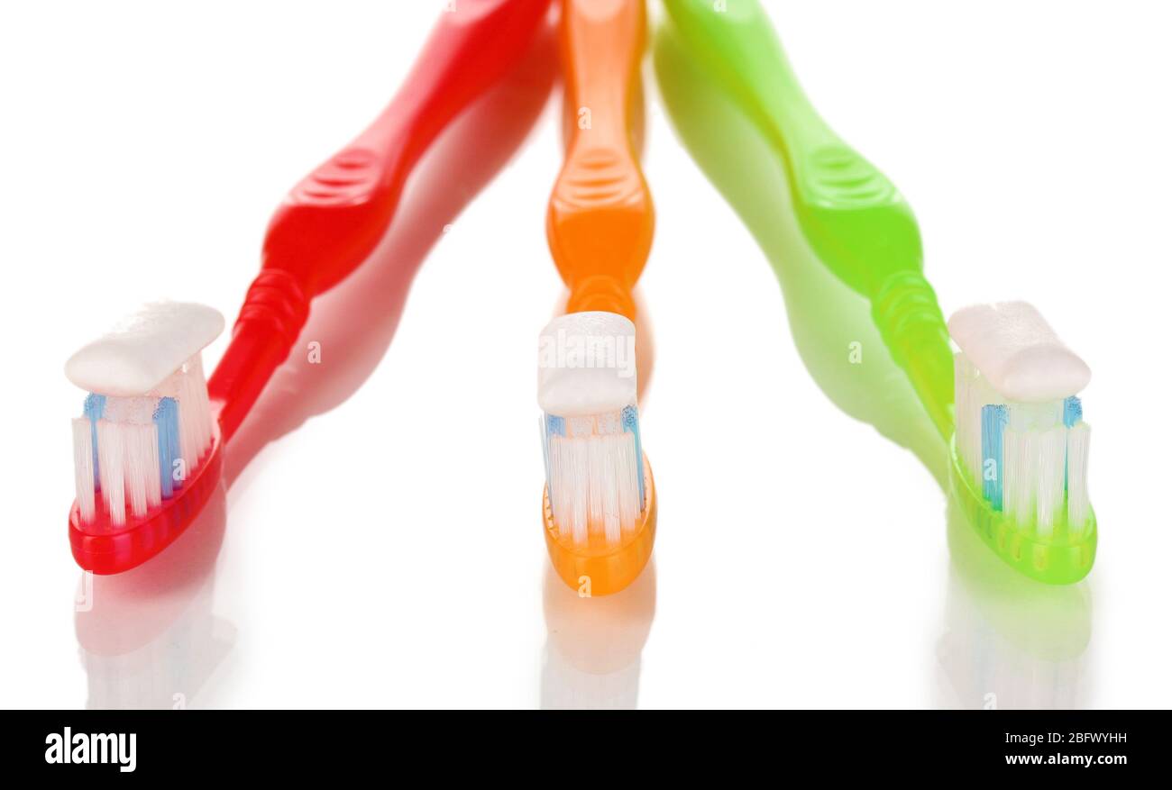Toothbrushes and chewing gum isolated on white Stock Photo - Alamy