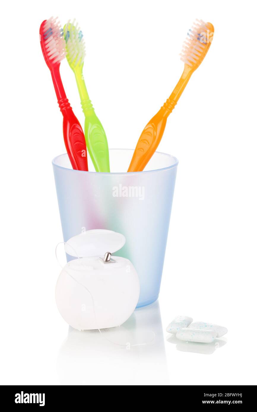 Toothbrushes, chewing gum and dental floss isolated on white Stock ...