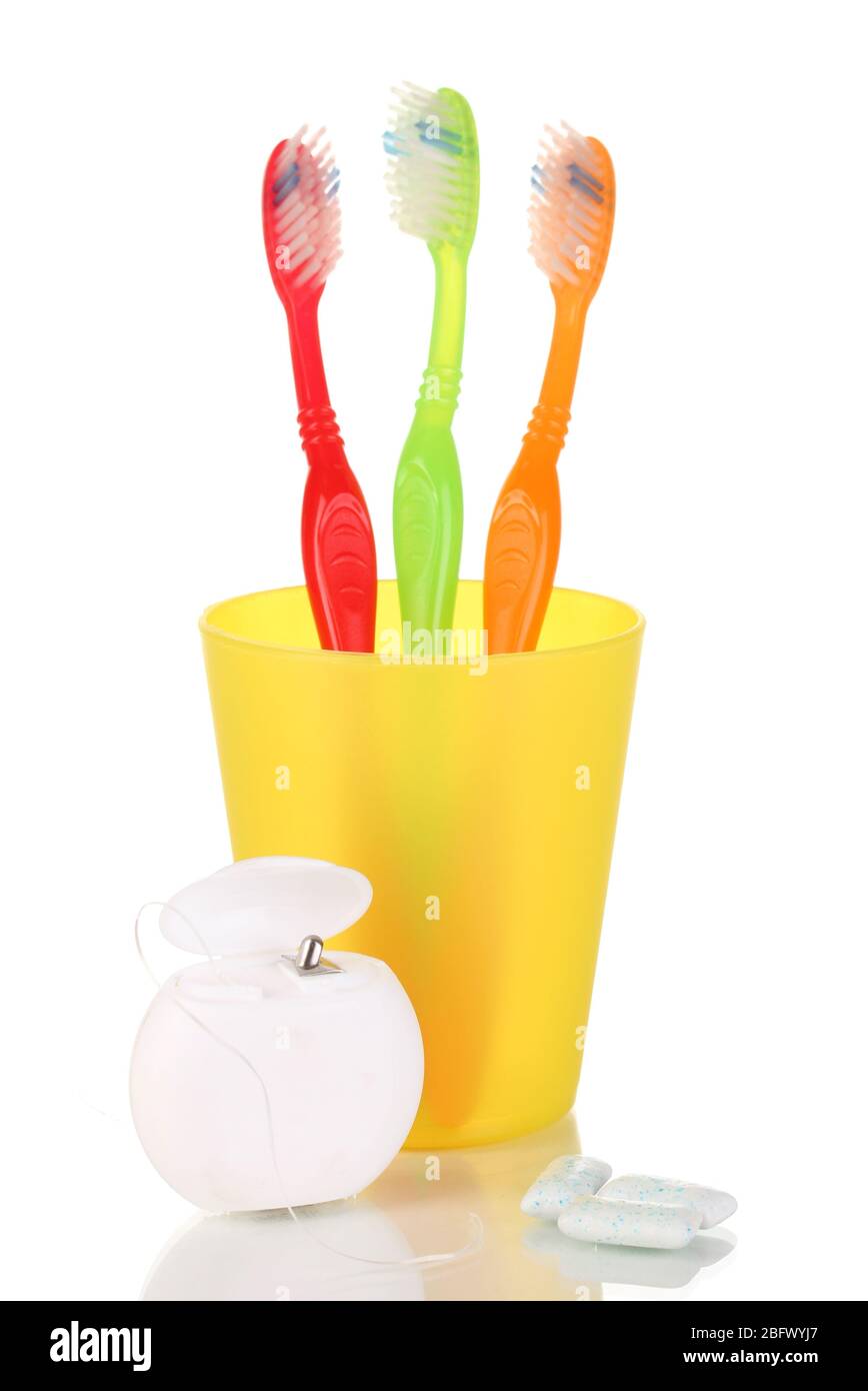 Toothbrushes, chewing gum and dental floss isolated on white Stock ...