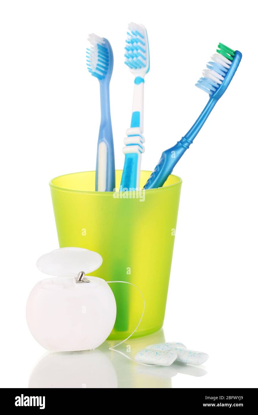 Toothbrushes, chewing gum and dental floss isolated on white Stock ...