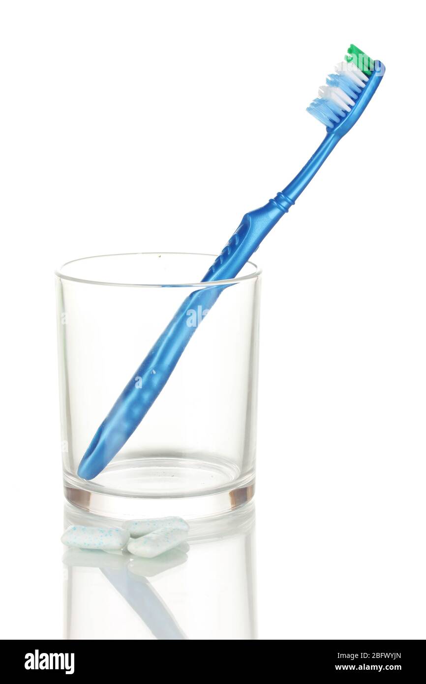 Toothbrush in glass and chewing gum isolated on white Stock Photo - Alamy