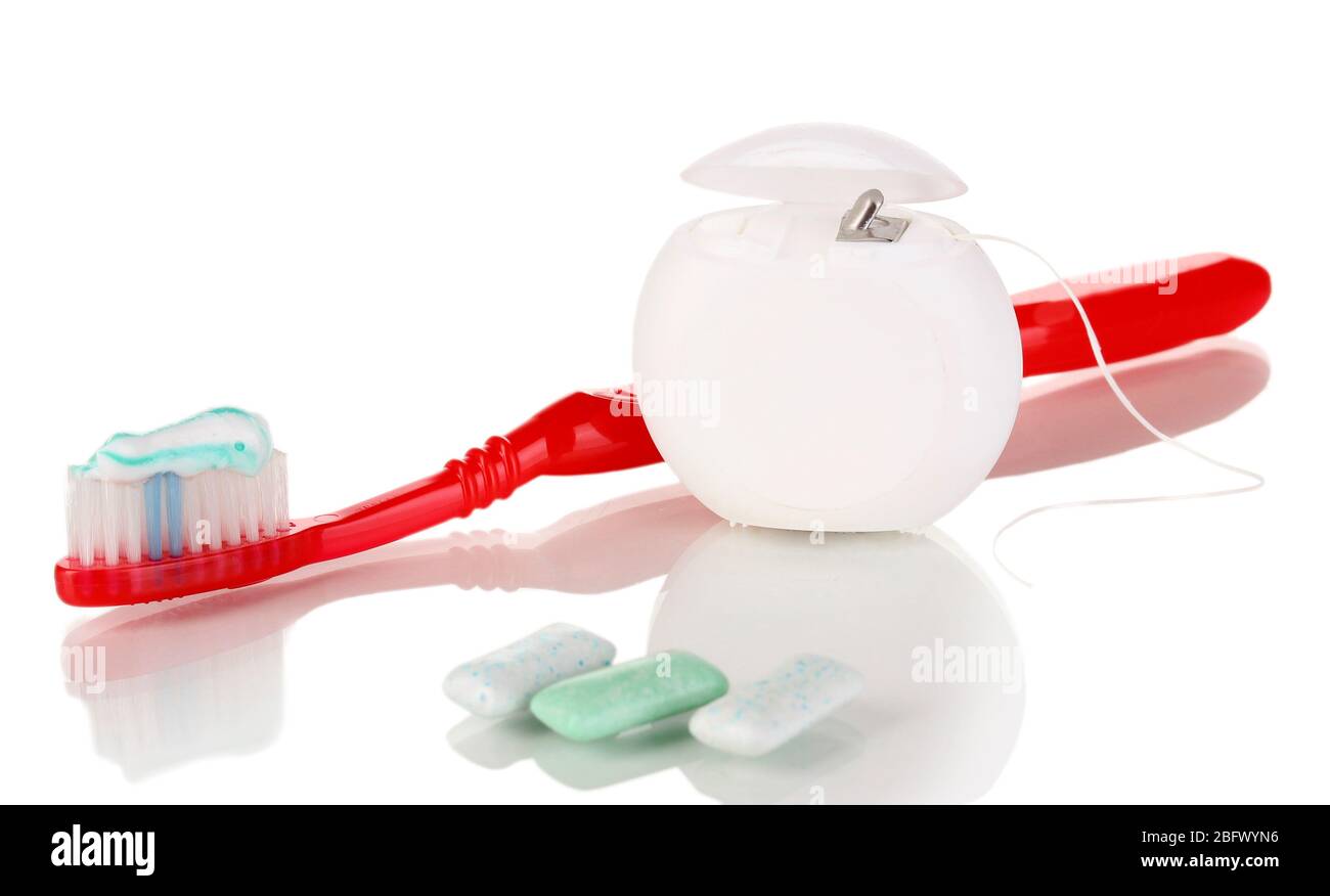 Toothbrush, chewing gum and dental floss isolated on white Stock Photo ...