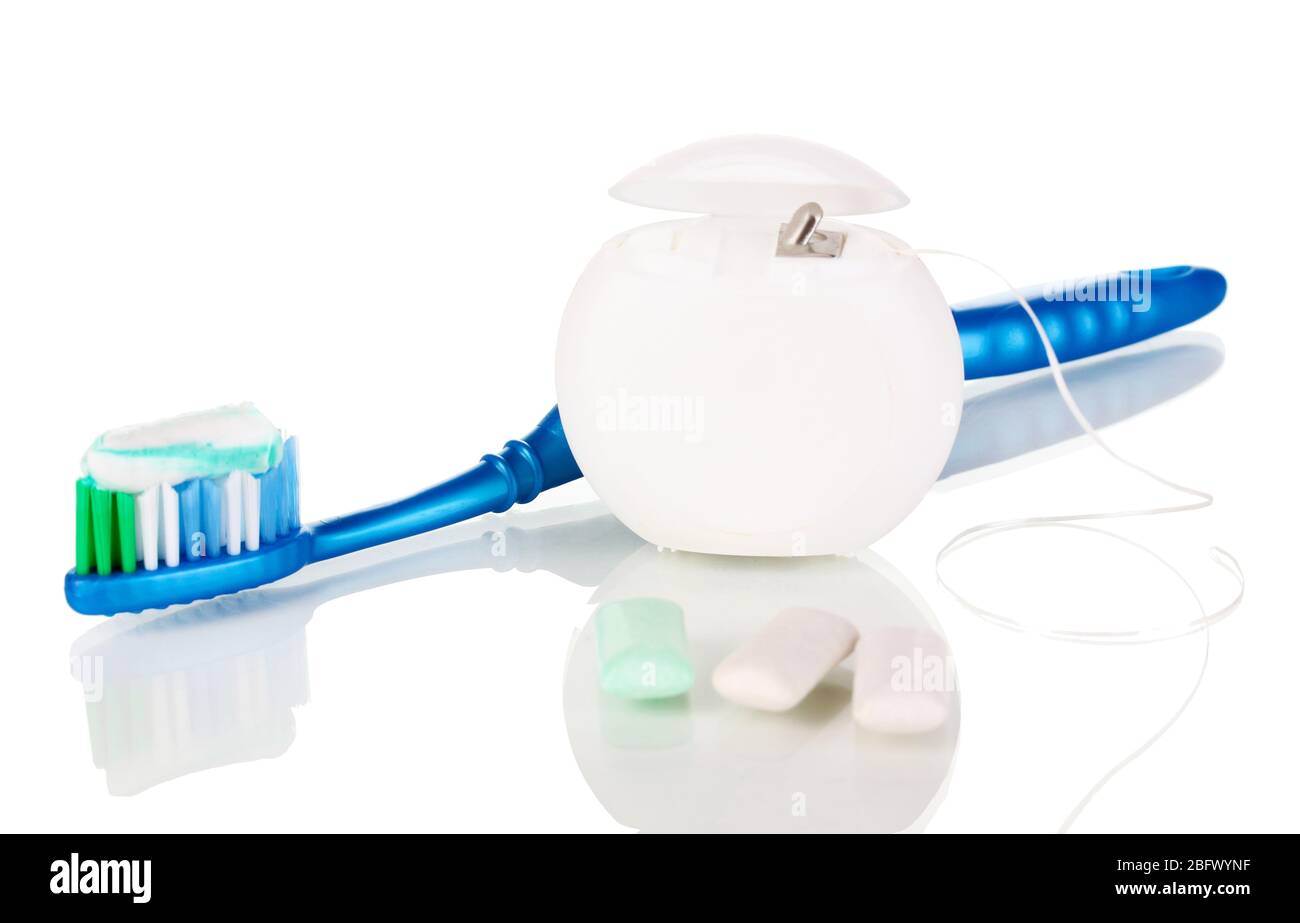 Toothbrush, chewing gum and dental floss isolated on white Stock Photo ...