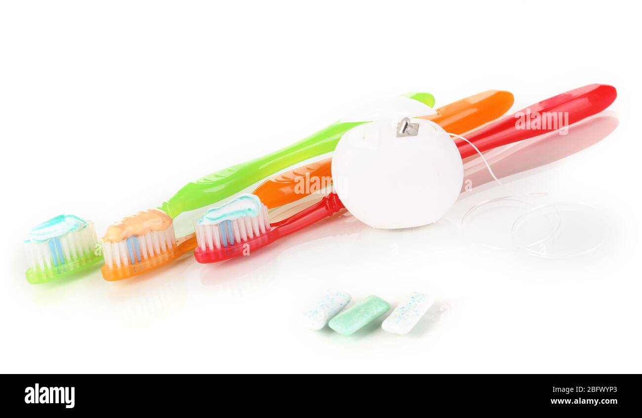 Toothbrush, chewing gum and dental floss isolated on white Stock Photo ...