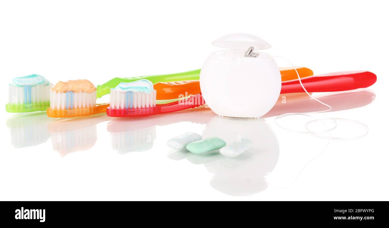 Toothbrush, chewing gum and dental floss isolated on white Stock Photo ...