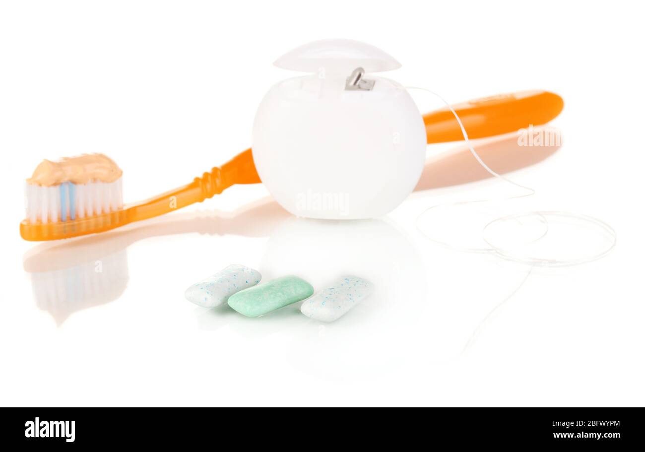 Toothbrush, chewing gum and dental floss isolated on white Stock Photo ...