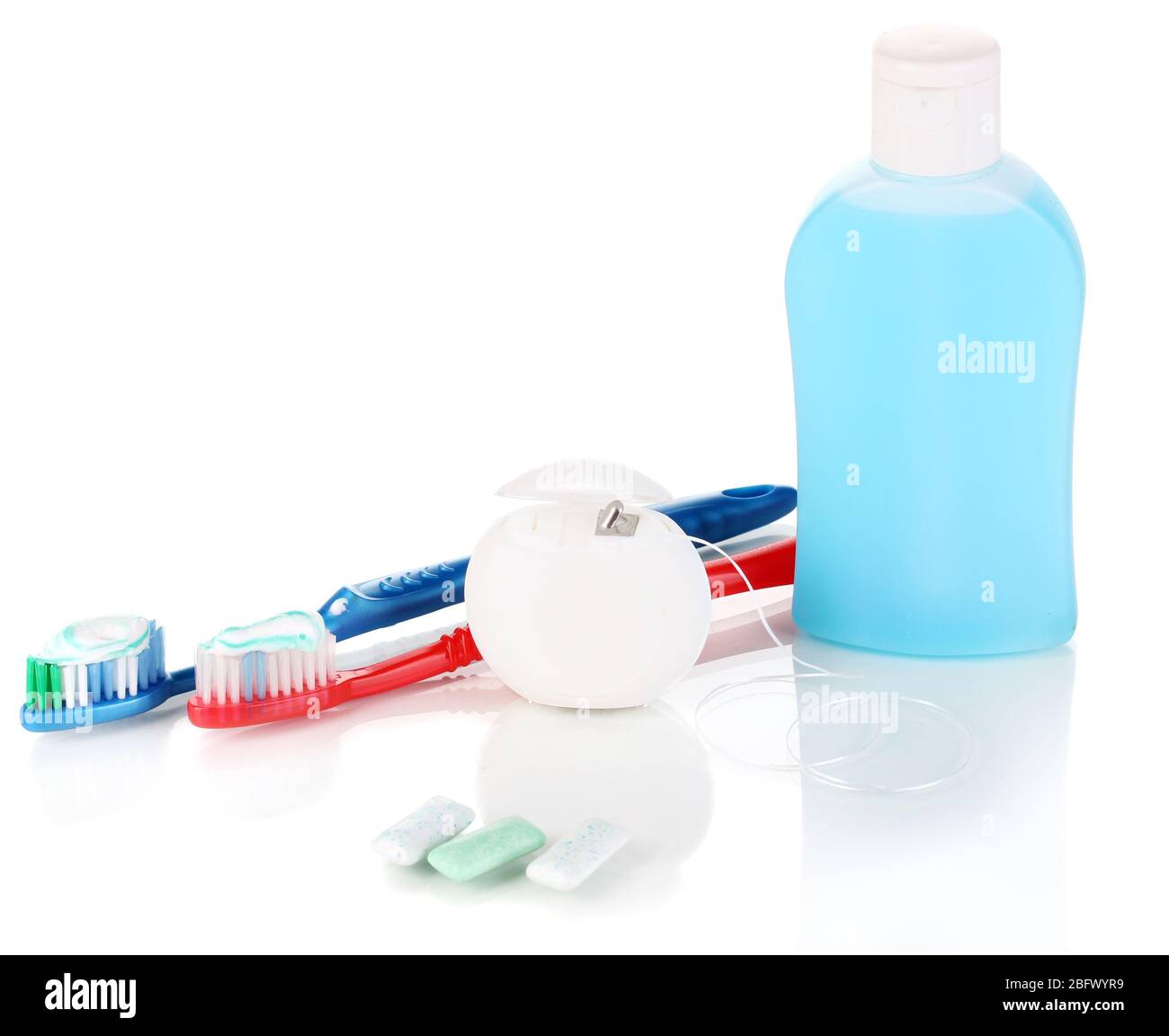 Toothbrush, chewing gum and dental floss isolated on white Stock Photo ...